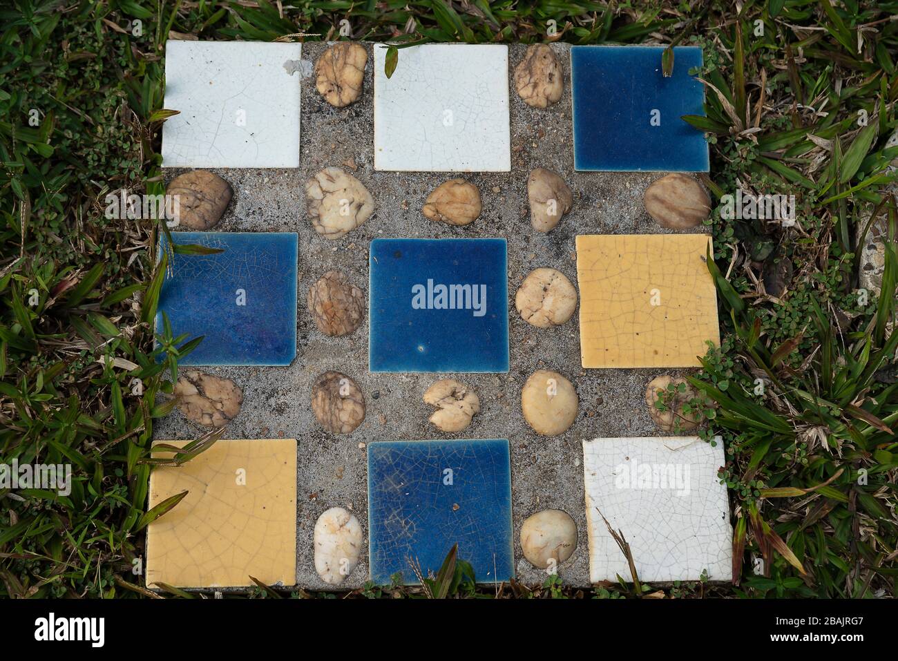 Colorful tile pavement for garden decoration Stock Photo - Alamy