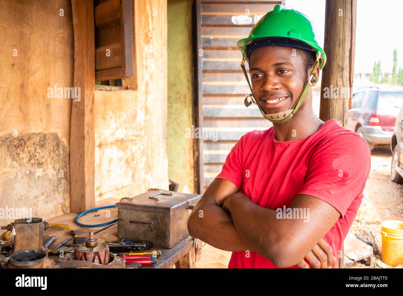 young nigerian engineer smiling in his place of work Stock Photo - Alamy