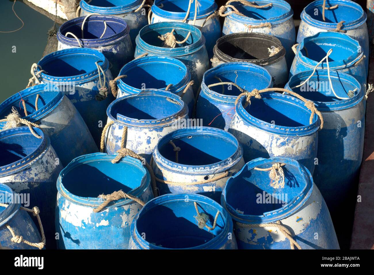 Large plastic Fish bucket Crates on a fishing boat Stock Photo - Alamy