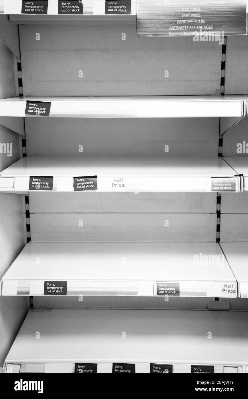 empty shelf in a shop with a sign saying temporarily out of stock Stock ...