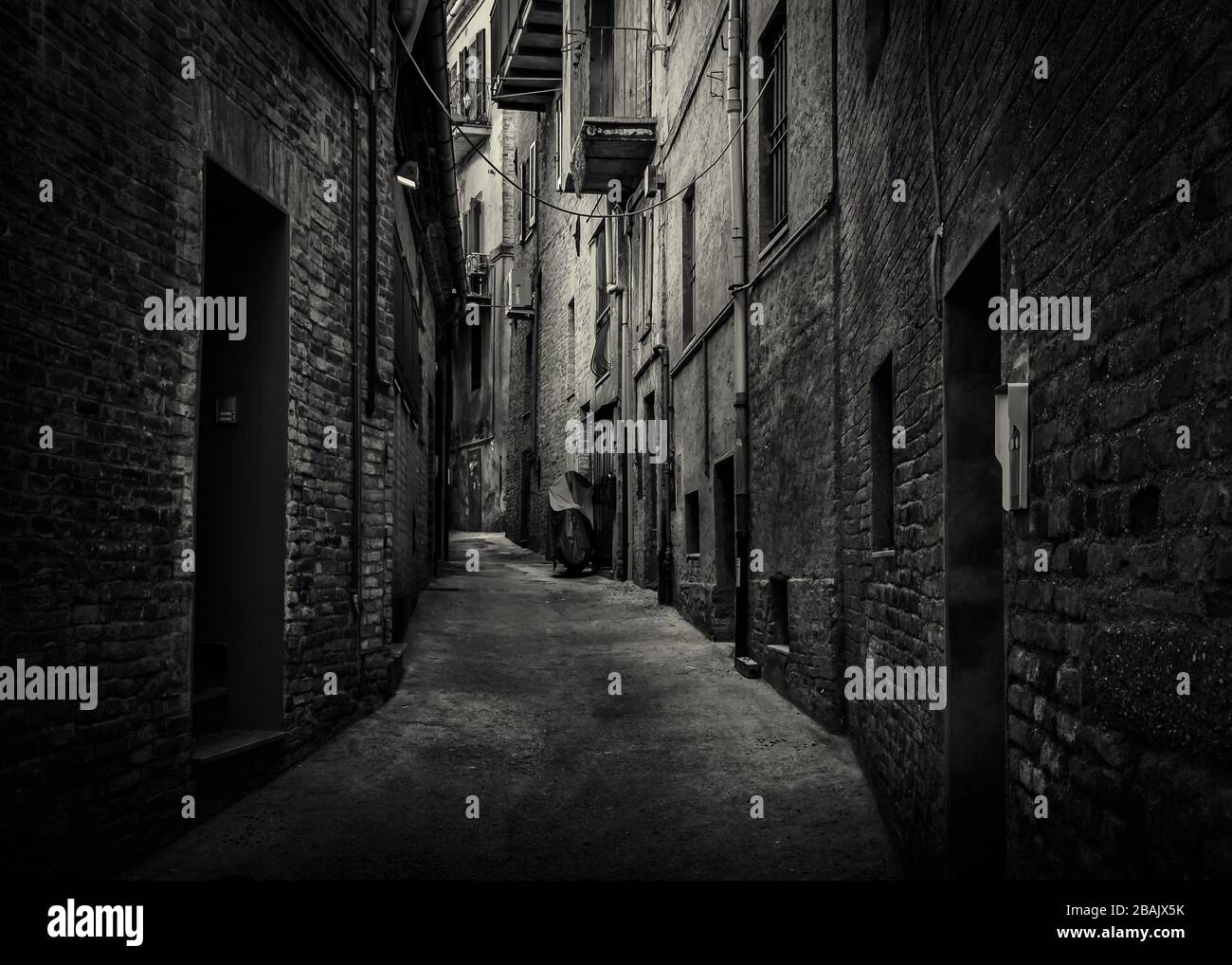 A dark and moody back alley taken in the historic town of Recanati ...