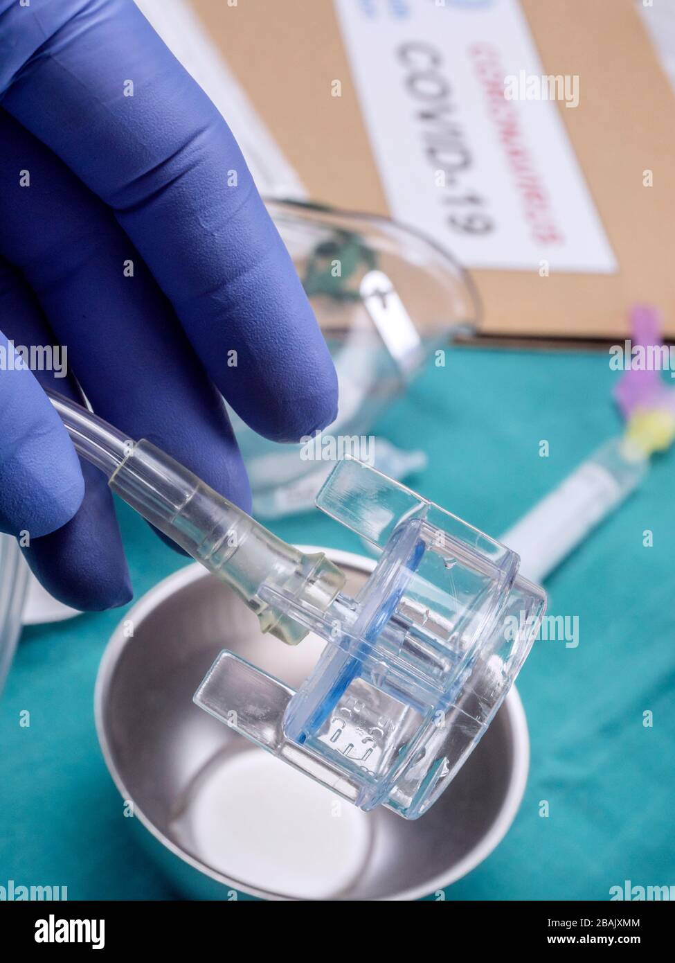 Nurse refilling medication solution nebulizer container Stock Photo - Alamy