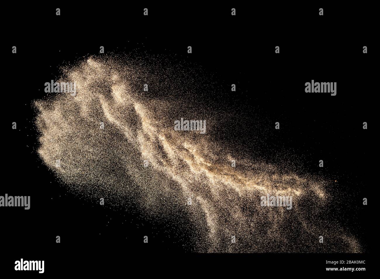 Brown colored sand splash.Dry river sand explosion isolated on black ...