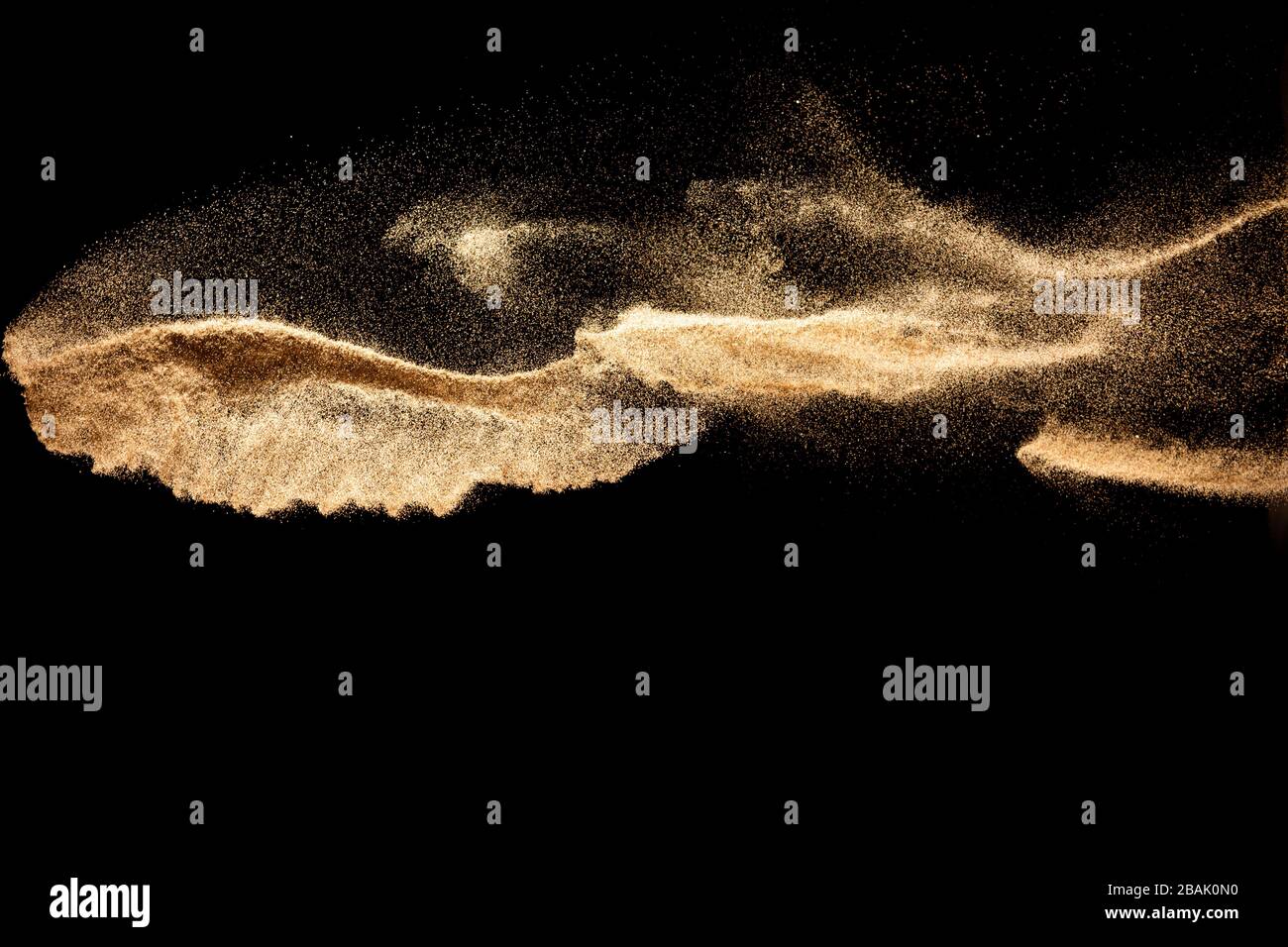 Brown colored sand splash.Dry river sand explosion isolated on black ...