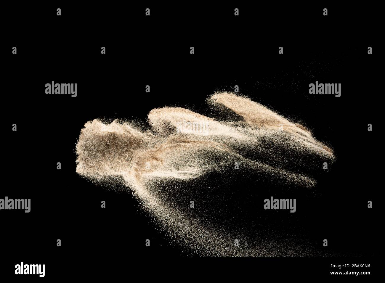 Brown colored sand splash.Dry river sand explosion isolated on black ...
