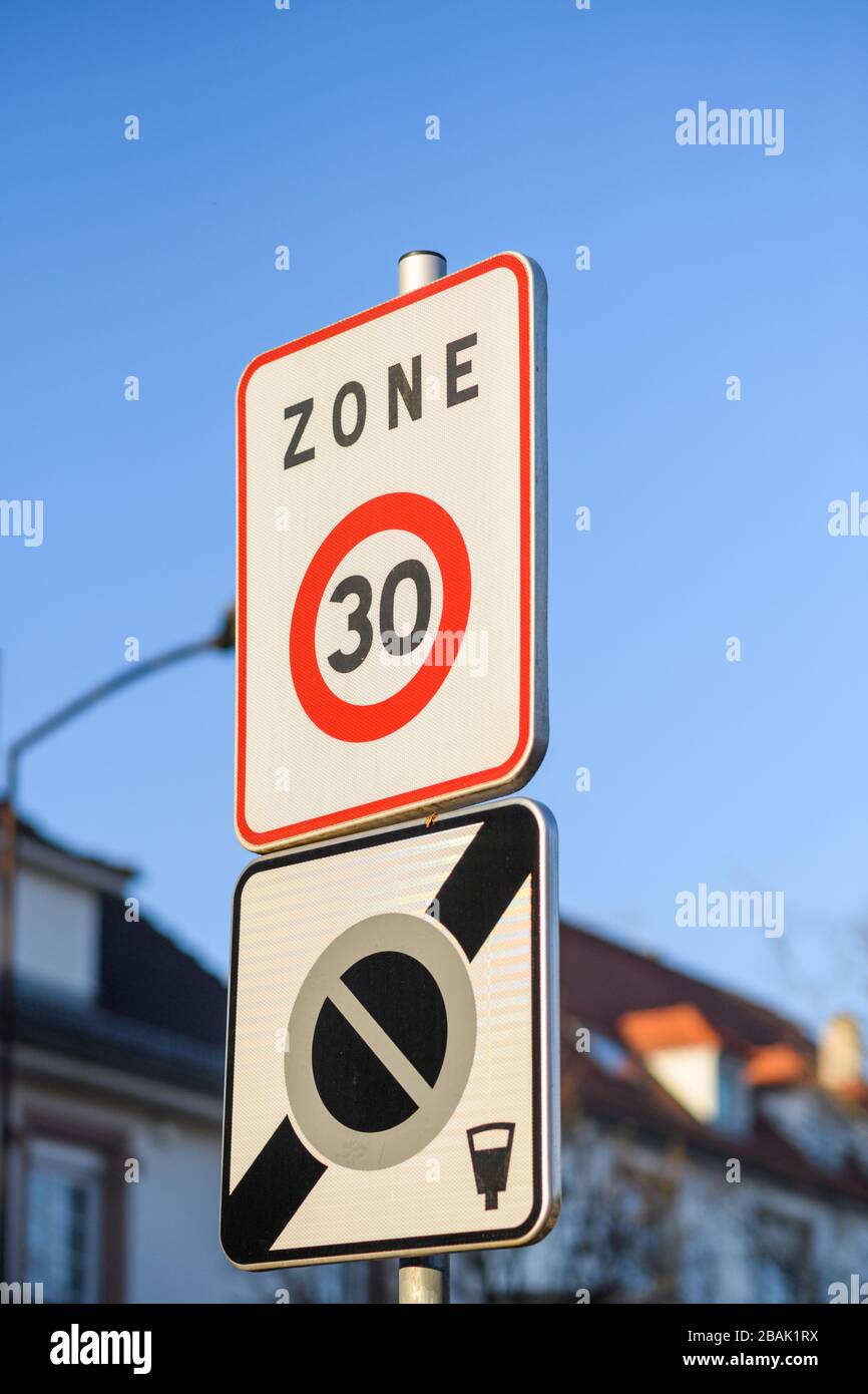 Zone 30 kilometers per hour and end of parking zone street sign with ...