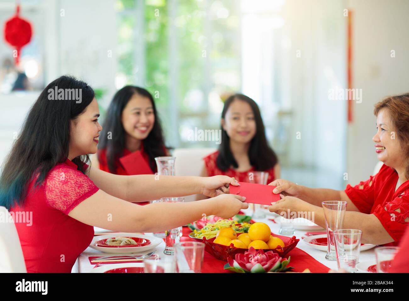 Chinese New Year celebration. Family celebrating winter holiday ...