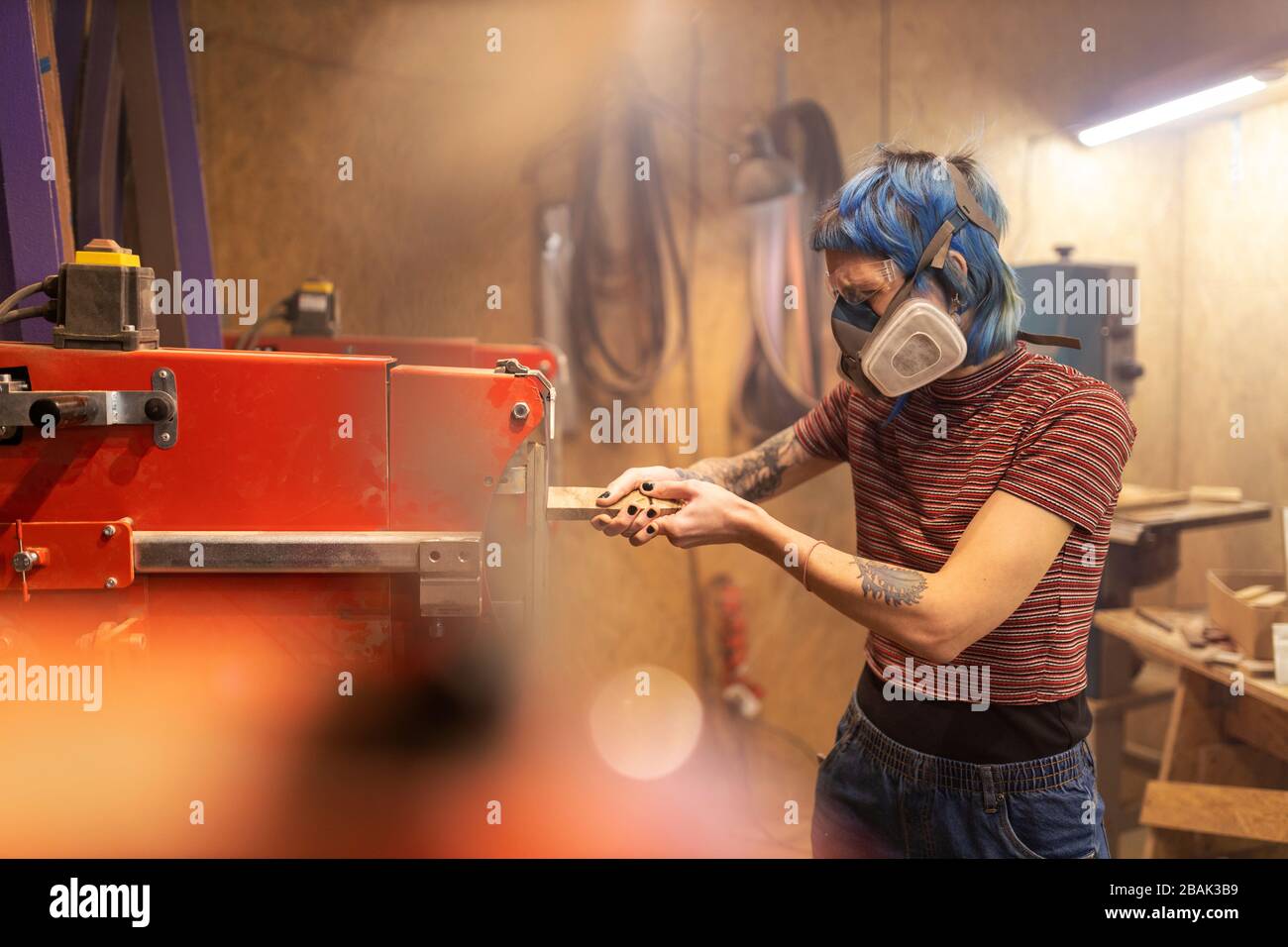 Young craftswoman during her work Stock Photo - Alamy