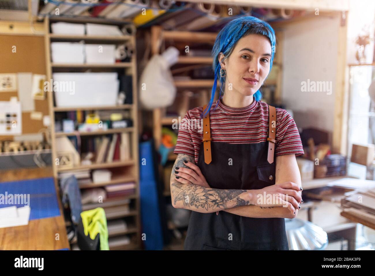 Young craftswoman during her work Stock Photo - Alamy