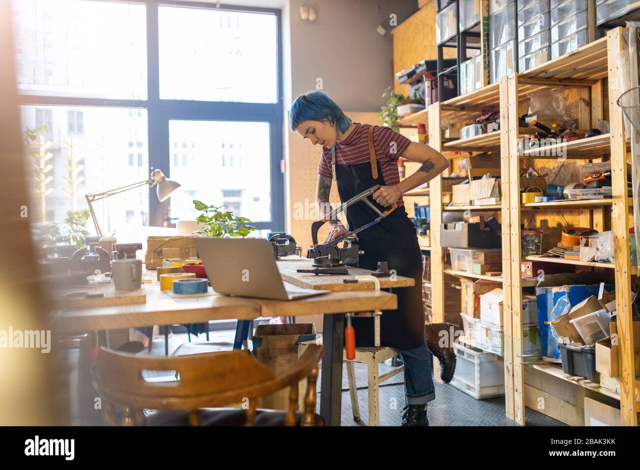 Young craftswoman during her work Stock Photo - Alamy