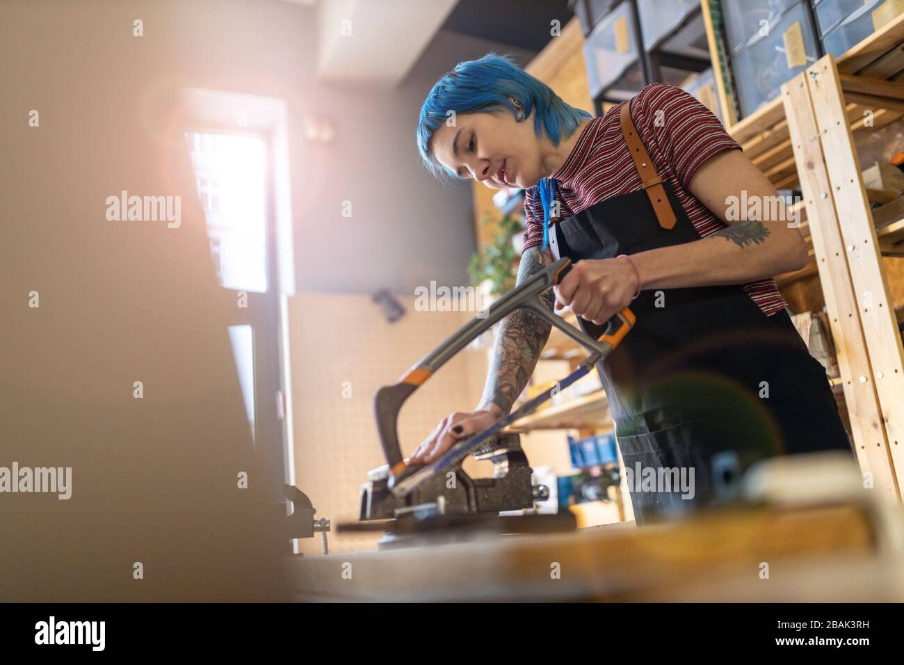Young craftswoman during her work Stock Photo - Alamy