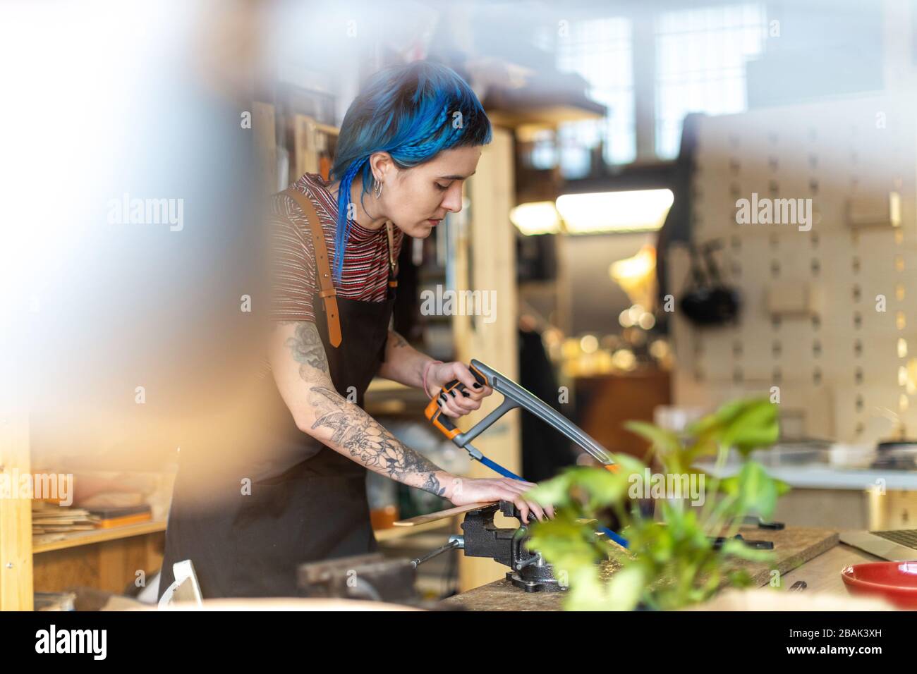 Young craftswoman during her work Stock Photo - Alamy
