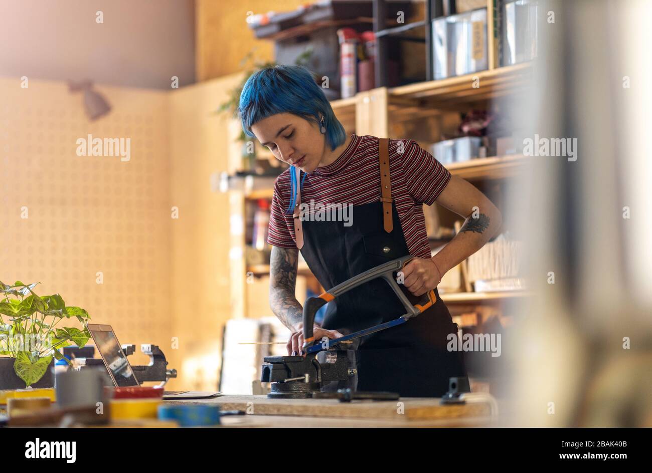 Young craftswoman during her work Stock Photo - Alamy