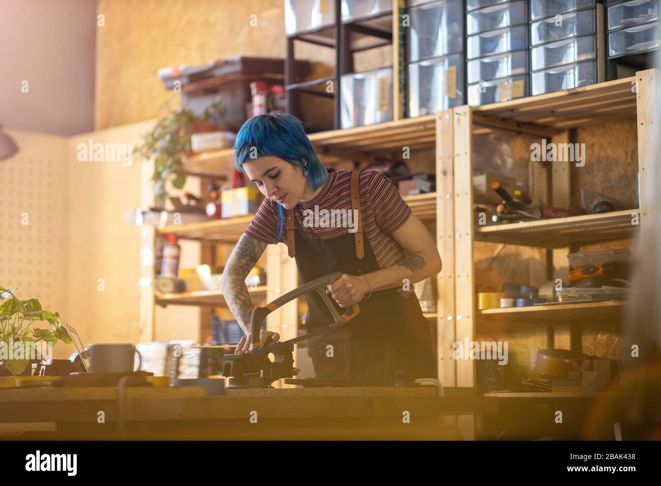 Young craftswoman during her work Stock Photo - Alamy