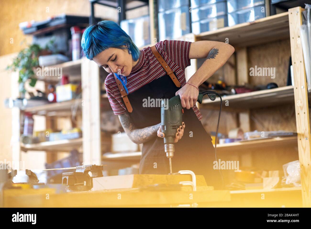 Young craftswoman during her work Stock Photo - Alamy