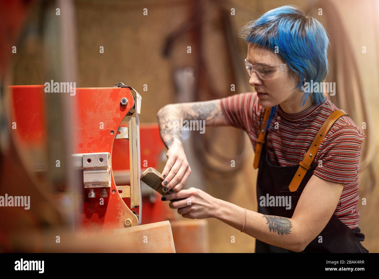 Young craftswoman during her work Stock Photo - Alamy