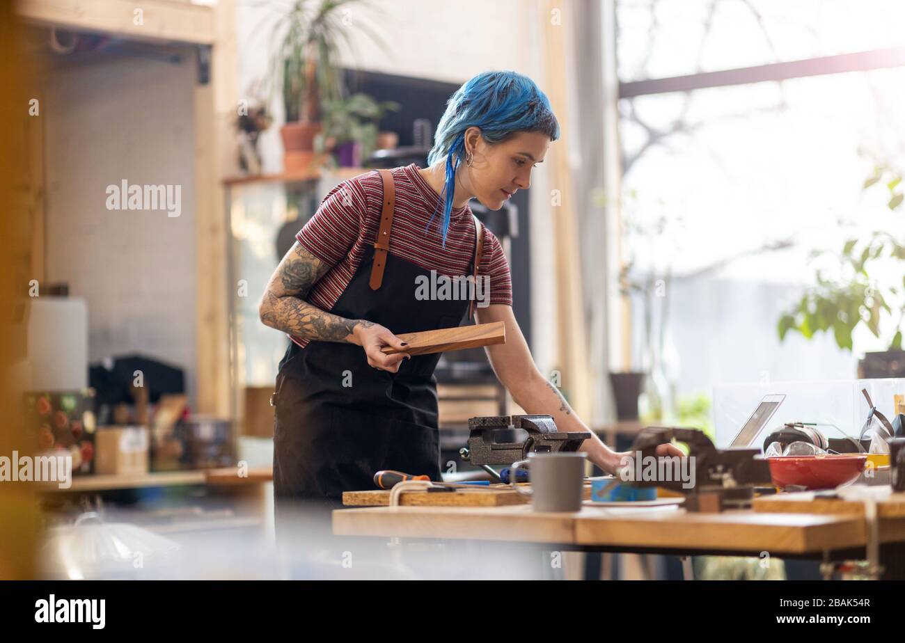 Young craftswoman during her work Stock Photo - Alamy
