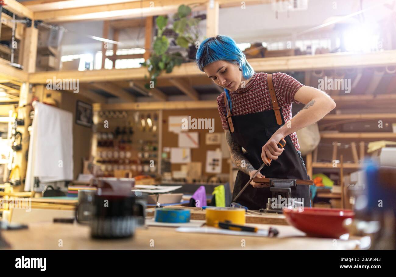 Young craftswoman during her work Stock Photo - Alamy