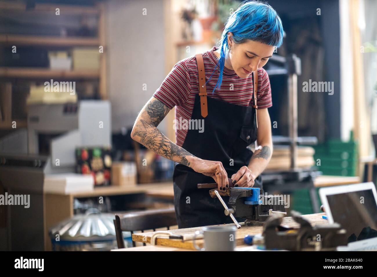 Young craftswoman during her work Stock Photo - Alamy