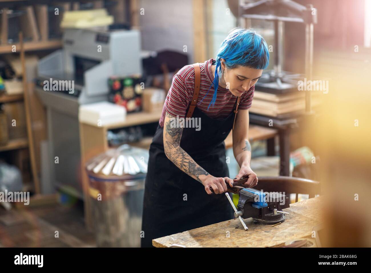Young craftswoman during her work Stock Photo - Alamy