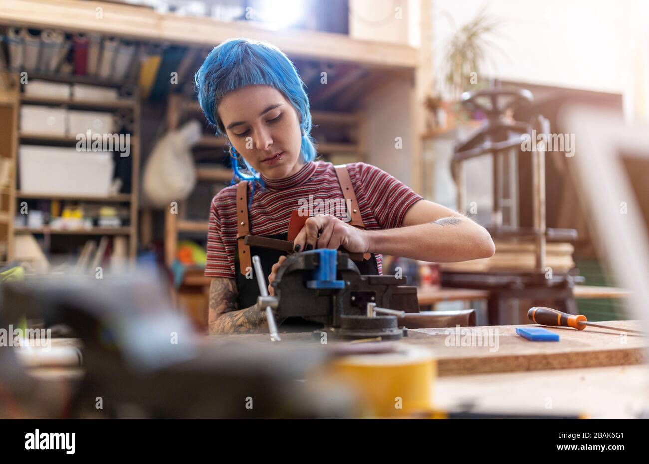 Young craftswoman during her work Stock Photo - Alamy