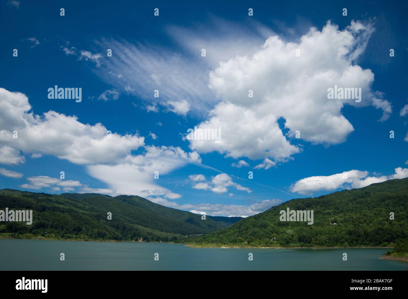 View of clouds above Maneciu Lake Stock Photo - Alamy