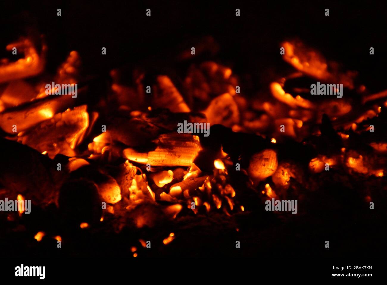 A bunch of vegetables on display lit up at night Stock Photo - Alamy