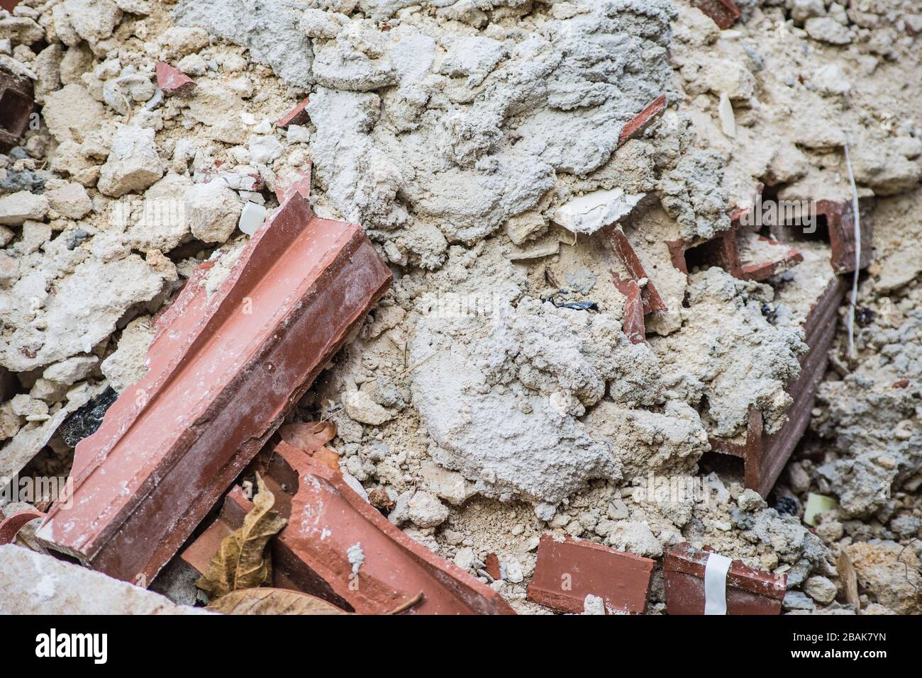 Background of building rubble with terracotta bricks and other white ...