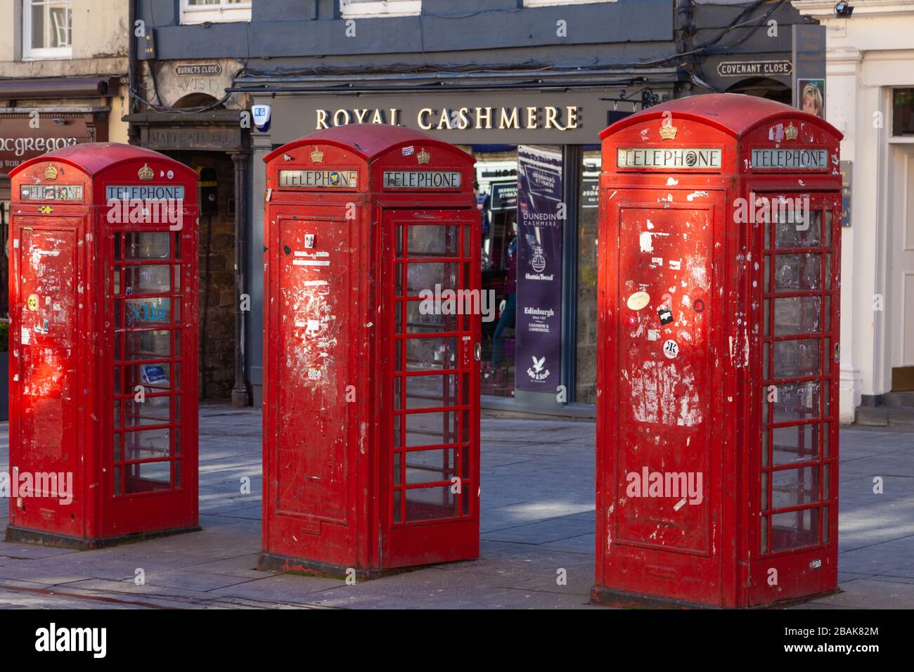 Three red British Telephone Boxes in row on the Royal Mile, Edinburgh ...