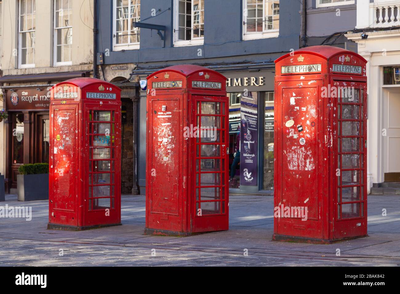 Three red British Telephone Boxes in row on the Royal Mile, Edinburgh ...
