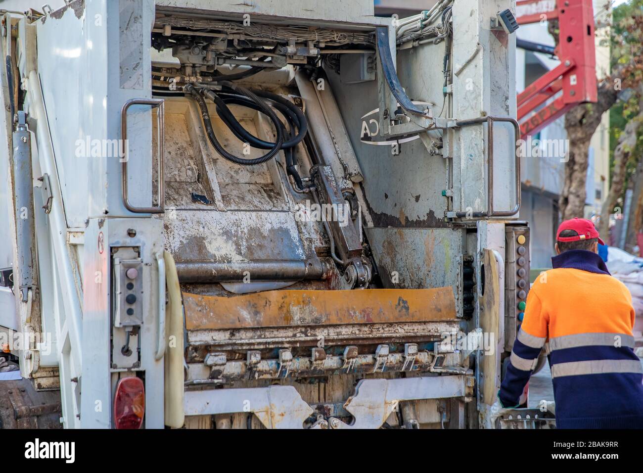 collecting waste from a container by a special car in the streets of a ...