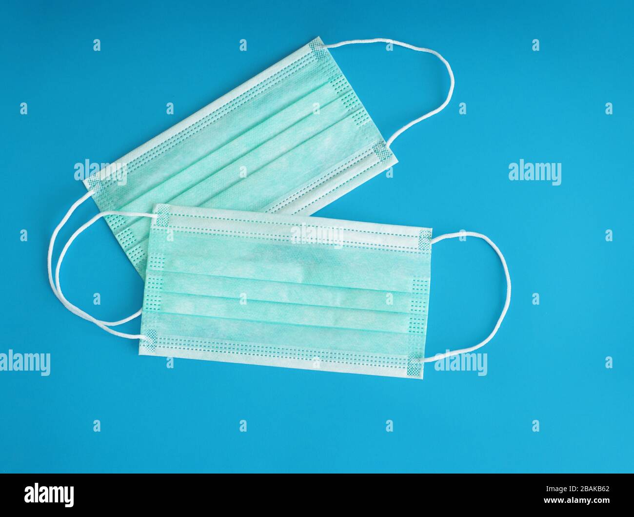 Surgical mask with rubber ear straps. Typical 3-ply surgical mask to ...