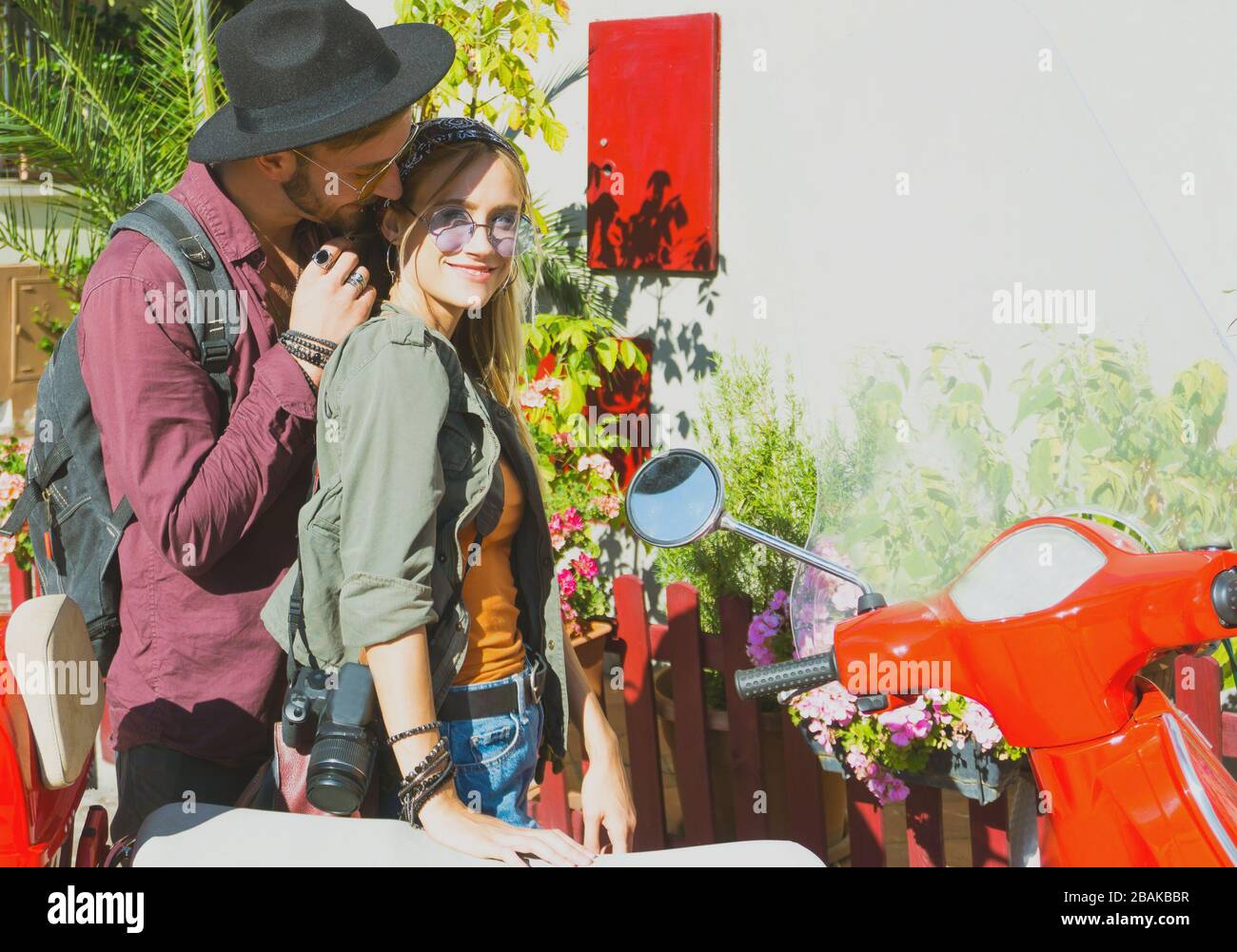 Young couple enjoying city streets in a sunny day - Vacations in europe ...