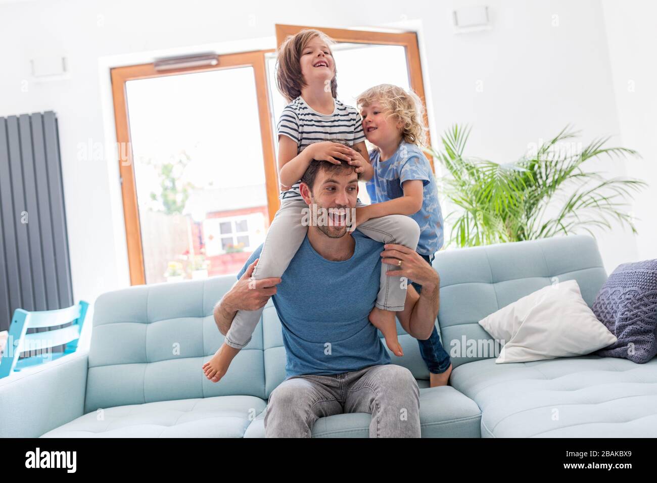 Father children playing home hi-res stock photography and images - Alamy