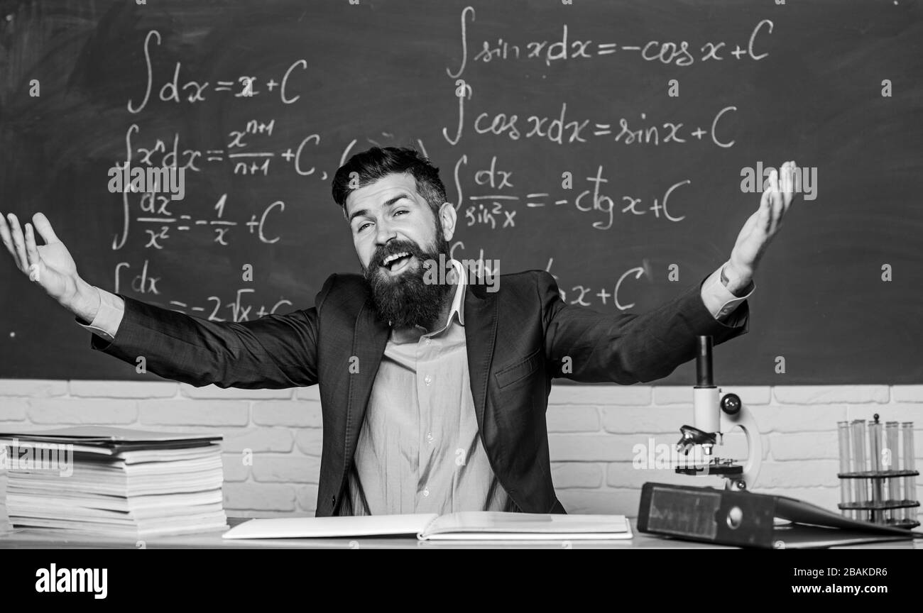 Happy welcome back to school. Happy teacher in school. Bearded man ...