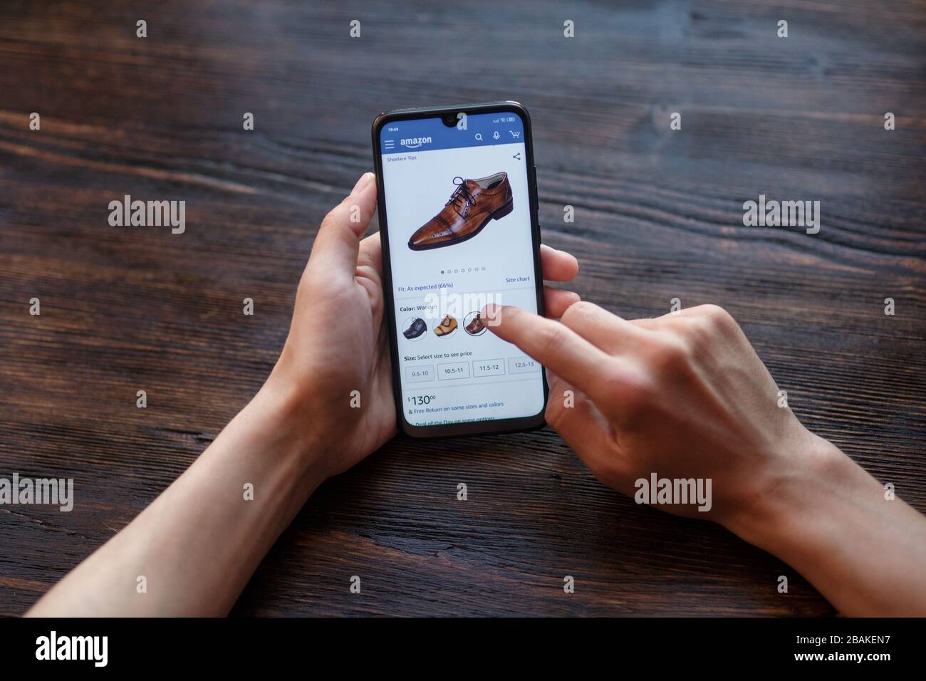 online shopping through the phone. hands with phone close up shopping ...