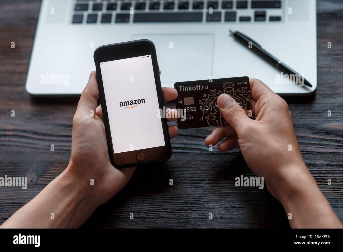 online shopping through the phone. hands with phone close up shopping ...