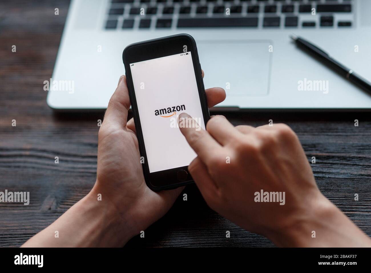 online shopping through the phone. hands with phone close up shopping ...