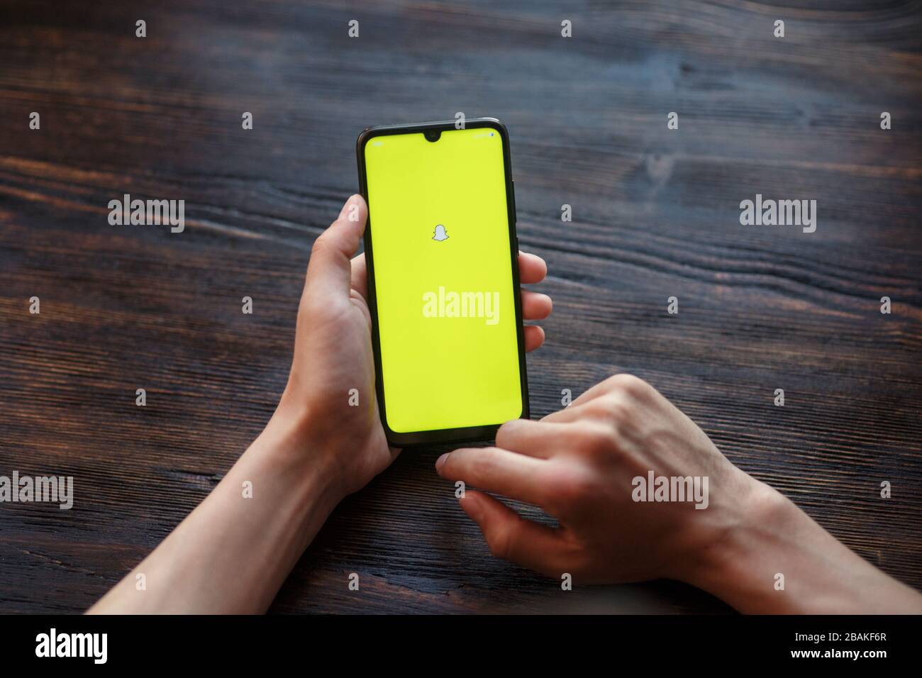 An apple iPhone showing the snapchat application alongside other ...