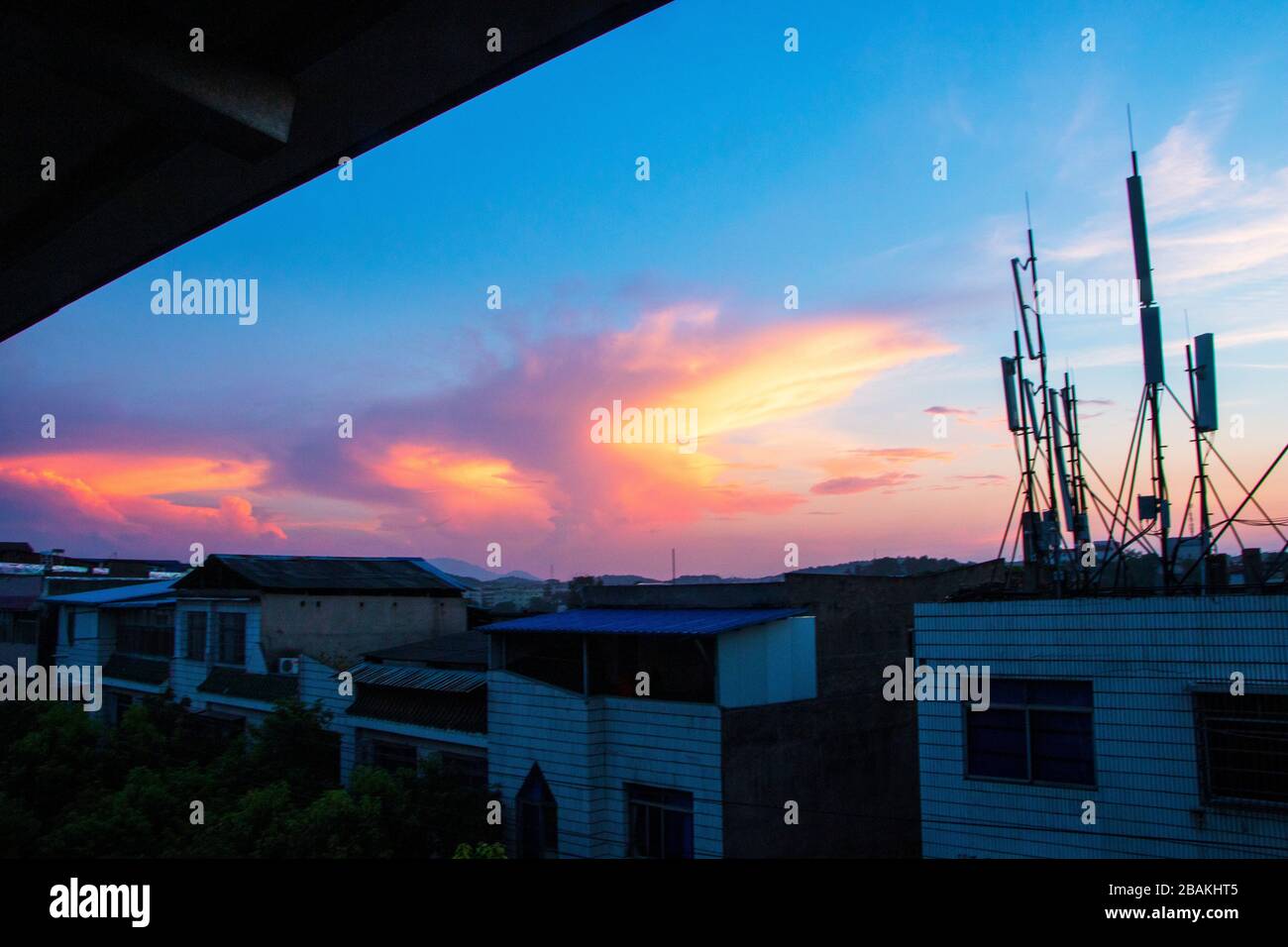 City buildings under the setting sun Stock Photo - Alamy