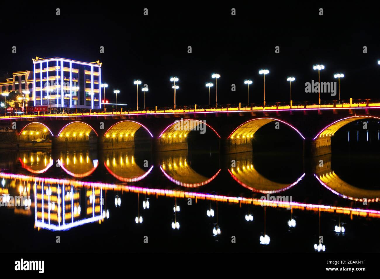 Stone arch bridge in the night Stock Photo - Alamy