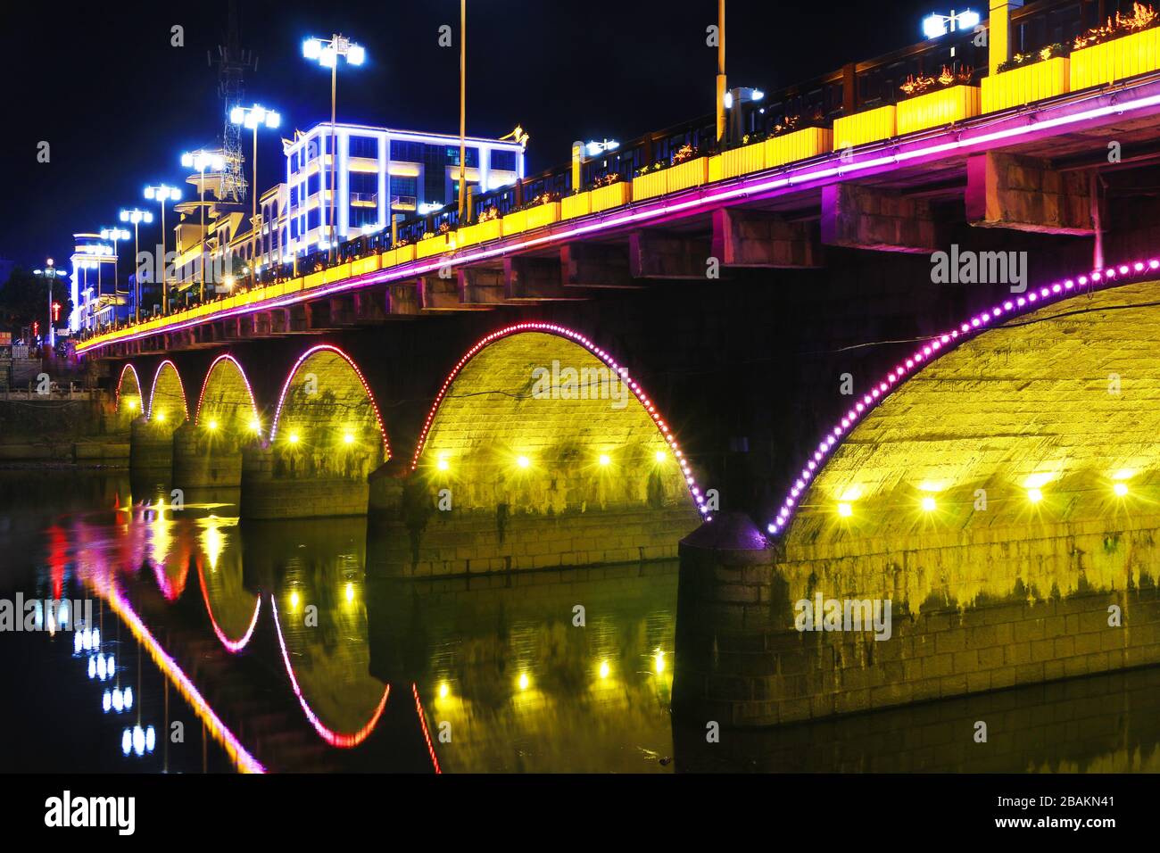 Stone arch bridge in the night Stock Photo - Alamy