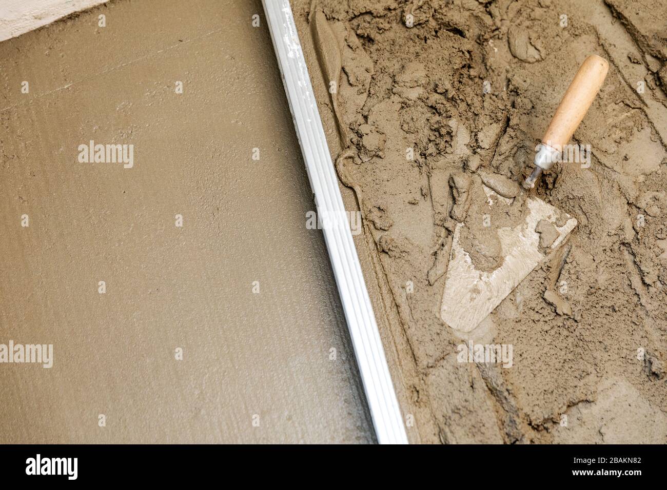 concrete screed floor align. trowel and rail on wet mortar Stock Photo ...