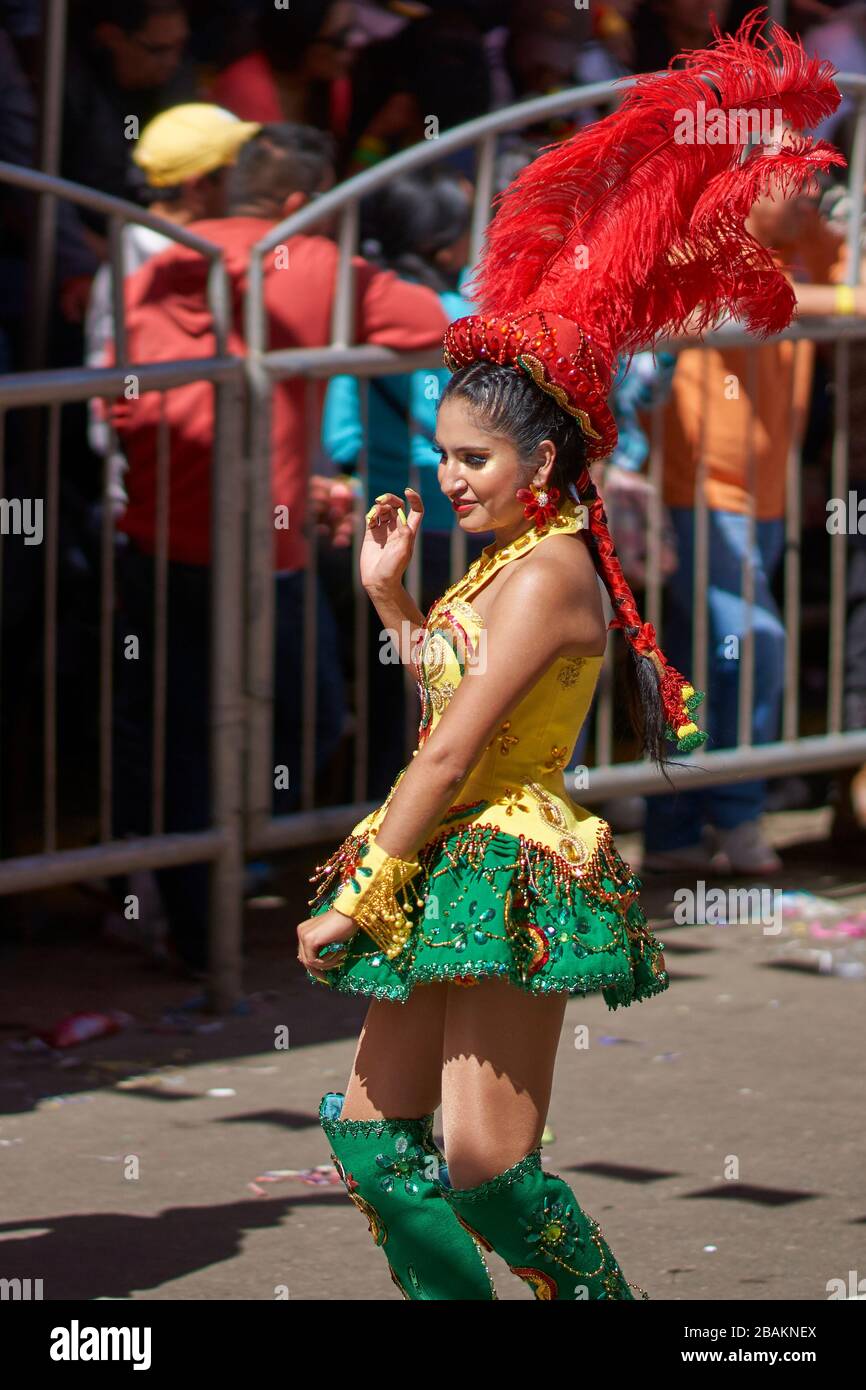Morenada dance group in colourful outfits parading through the mining ...