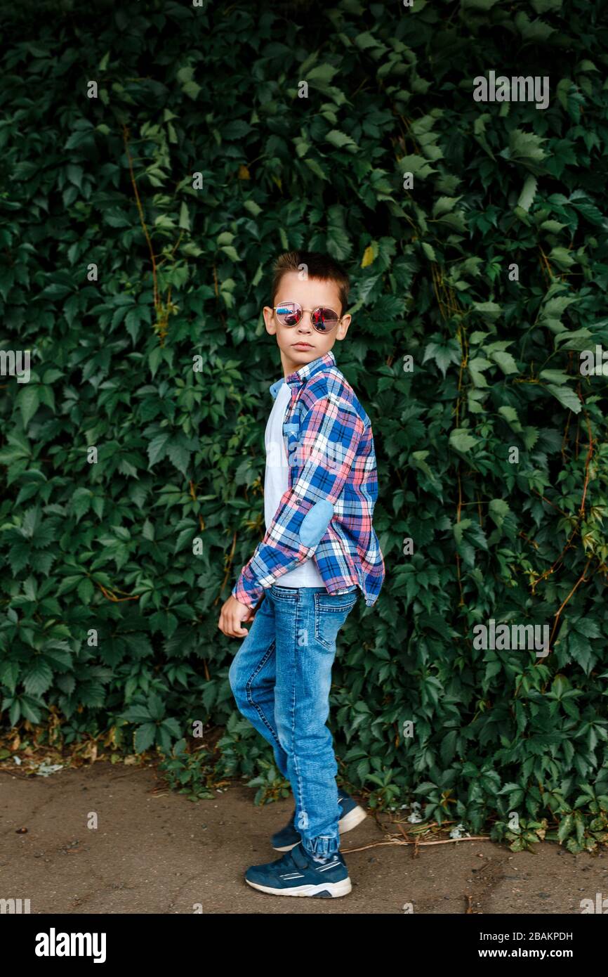 little model boy posing on the street park Stock Photo - Alamy