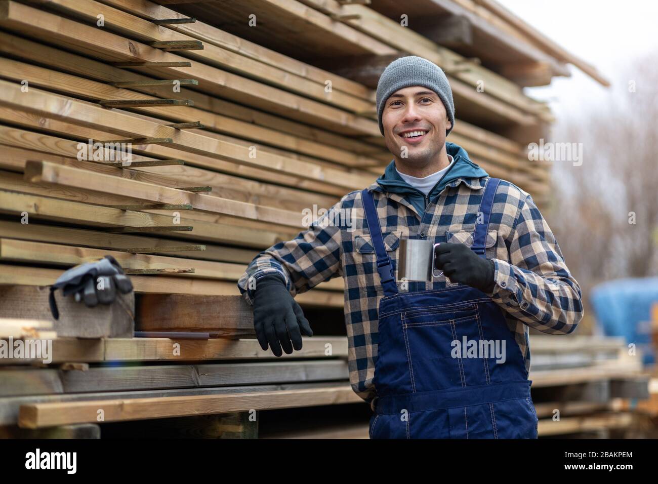Young male worker in timber warehouse Stock Photo - Alamy