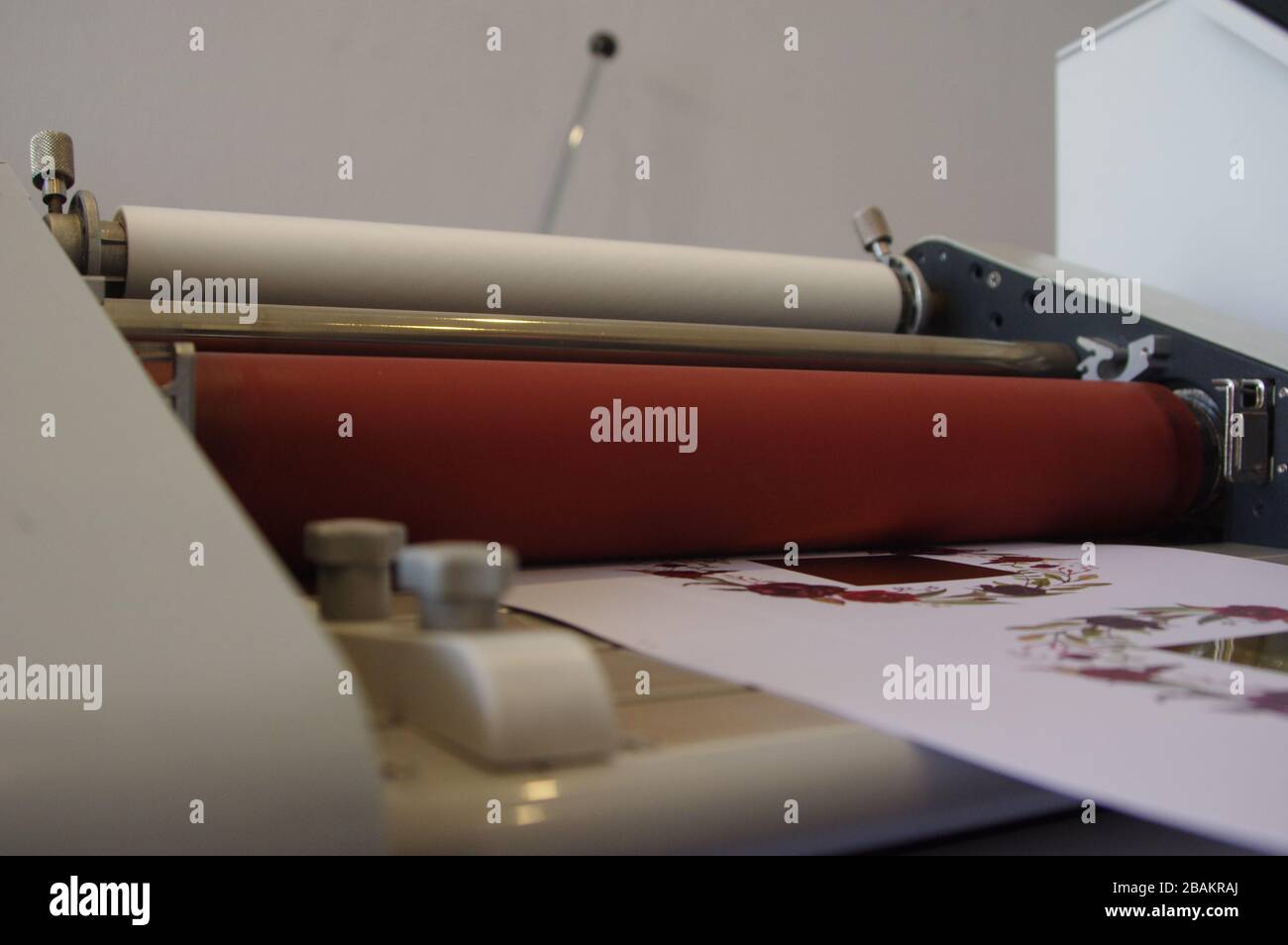 Plastic laminating machine Stock Photo - Alamy