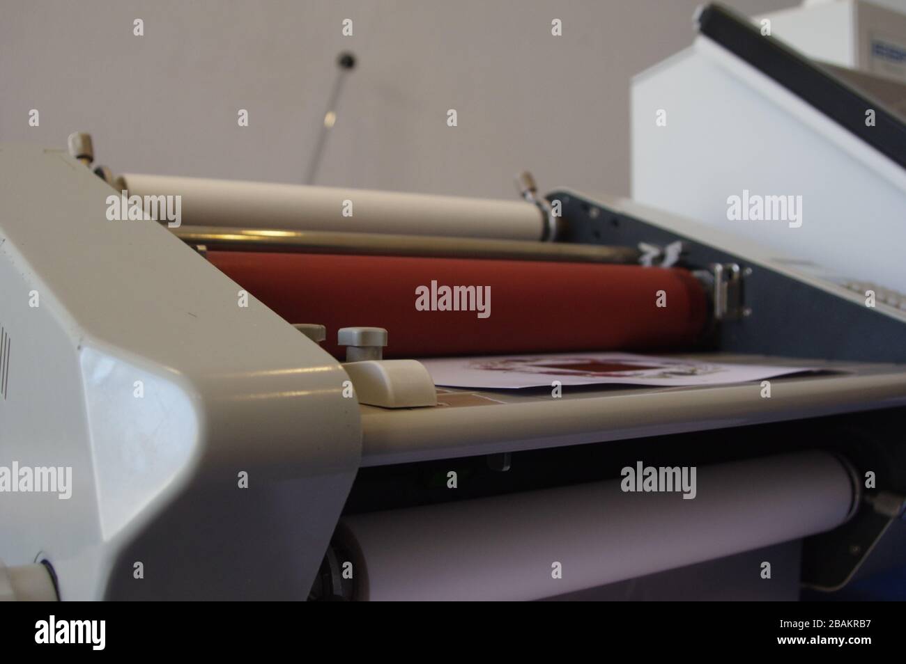 Plastic laminating machine Stock Photo - Alamy