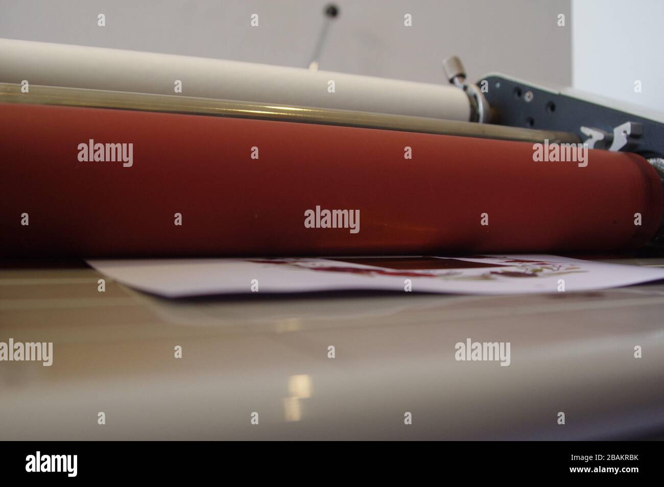 Plastic laminating machine Stock Photo - Alamy