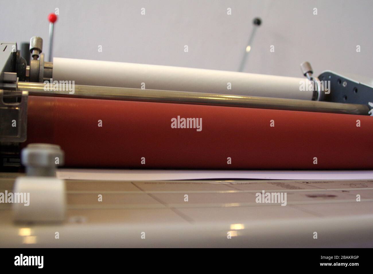 Plastic laminating machine Stock Photo - Alamy